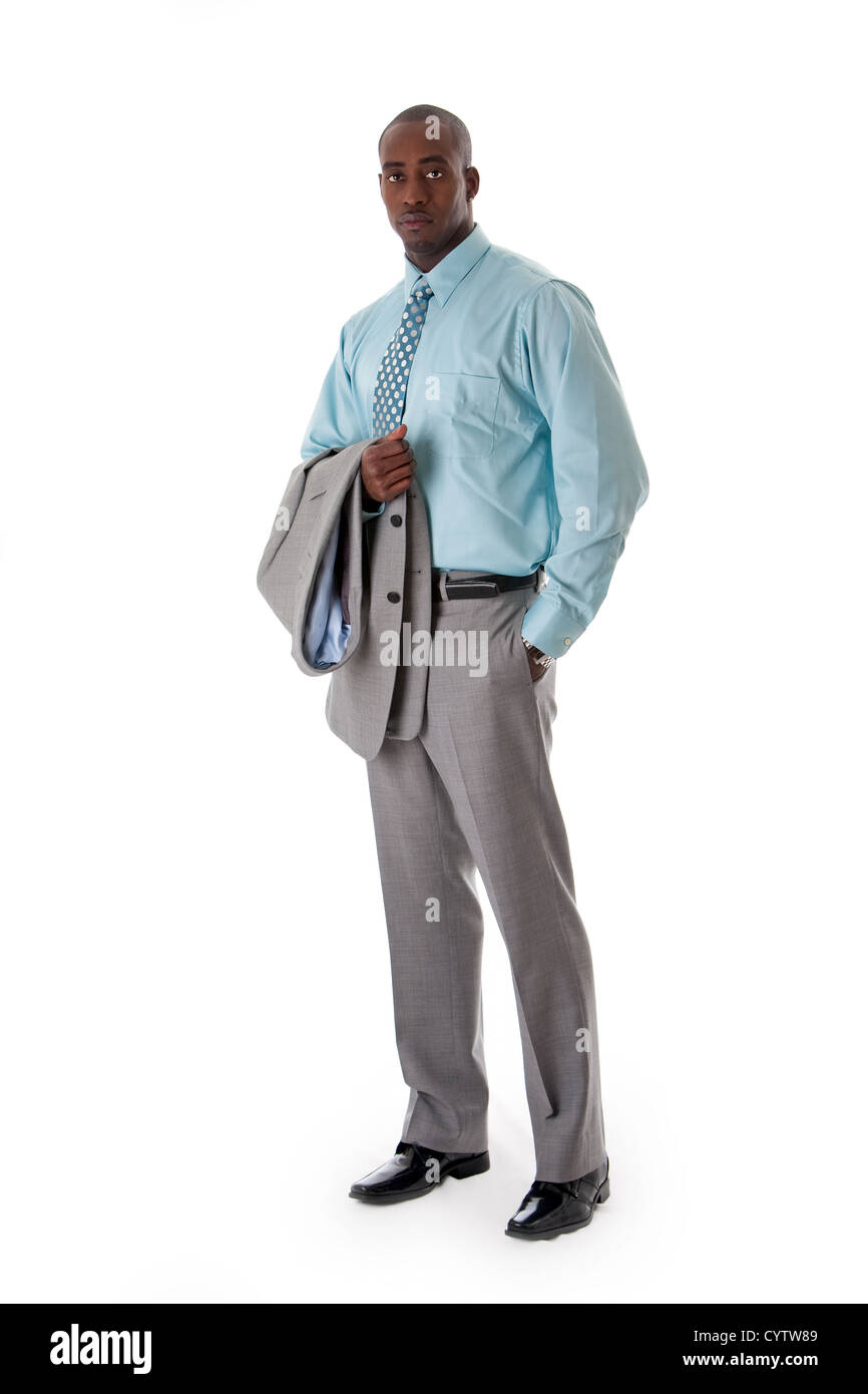 Handsome African American man in gray suit standing with hand in pocket ...