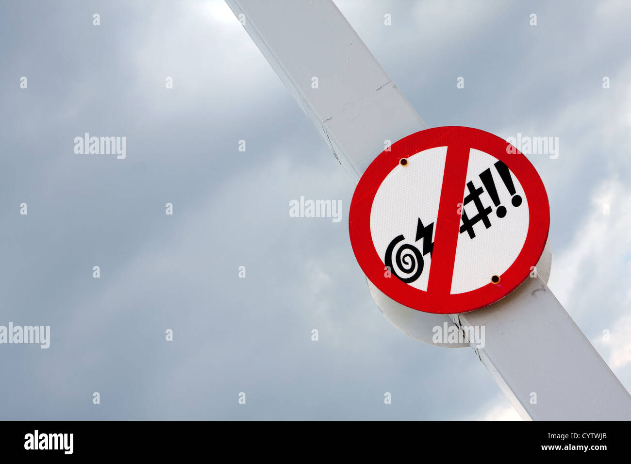 White round traffic street sign with red border that forbids cursing ...