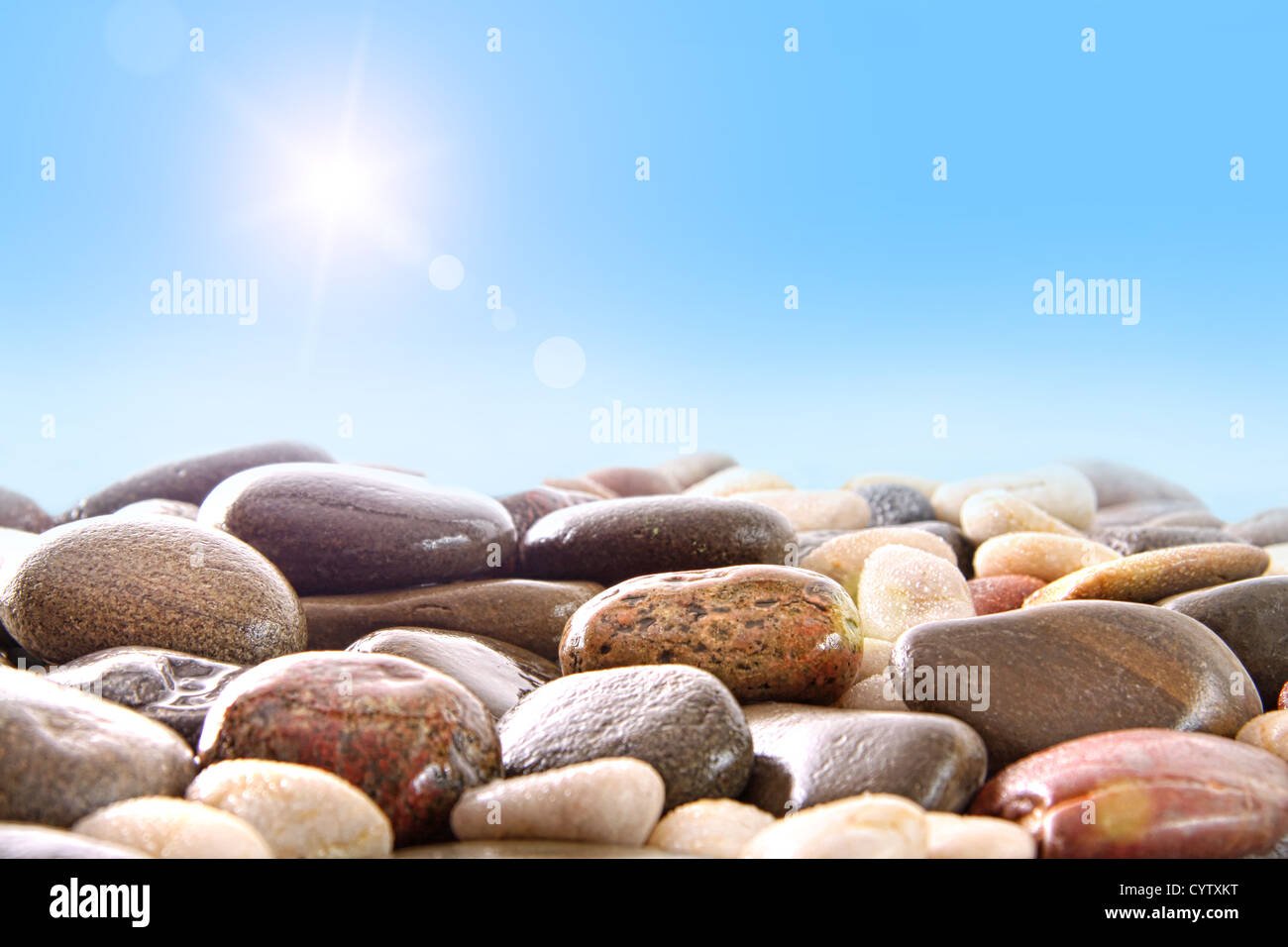 Pile of river rocks on white background Stock Photo - Alamy