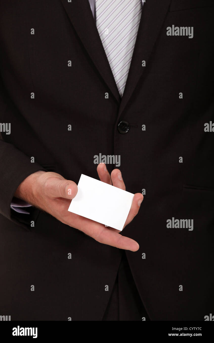 Businessman presenting his calling card Stock Photo - Alamy