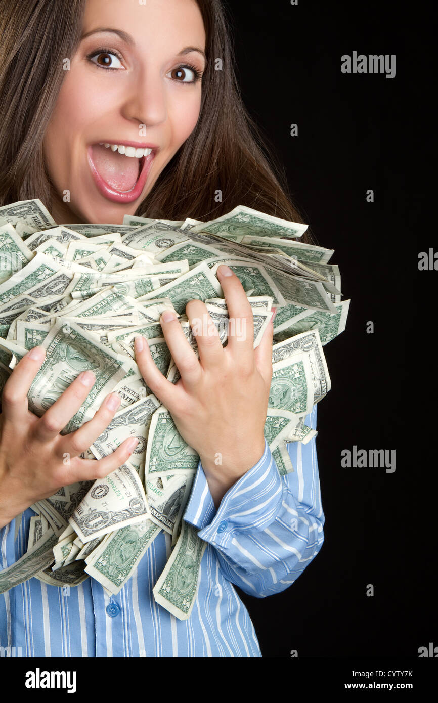 Beautiful excited woman holding money Stock Photo - Alamy