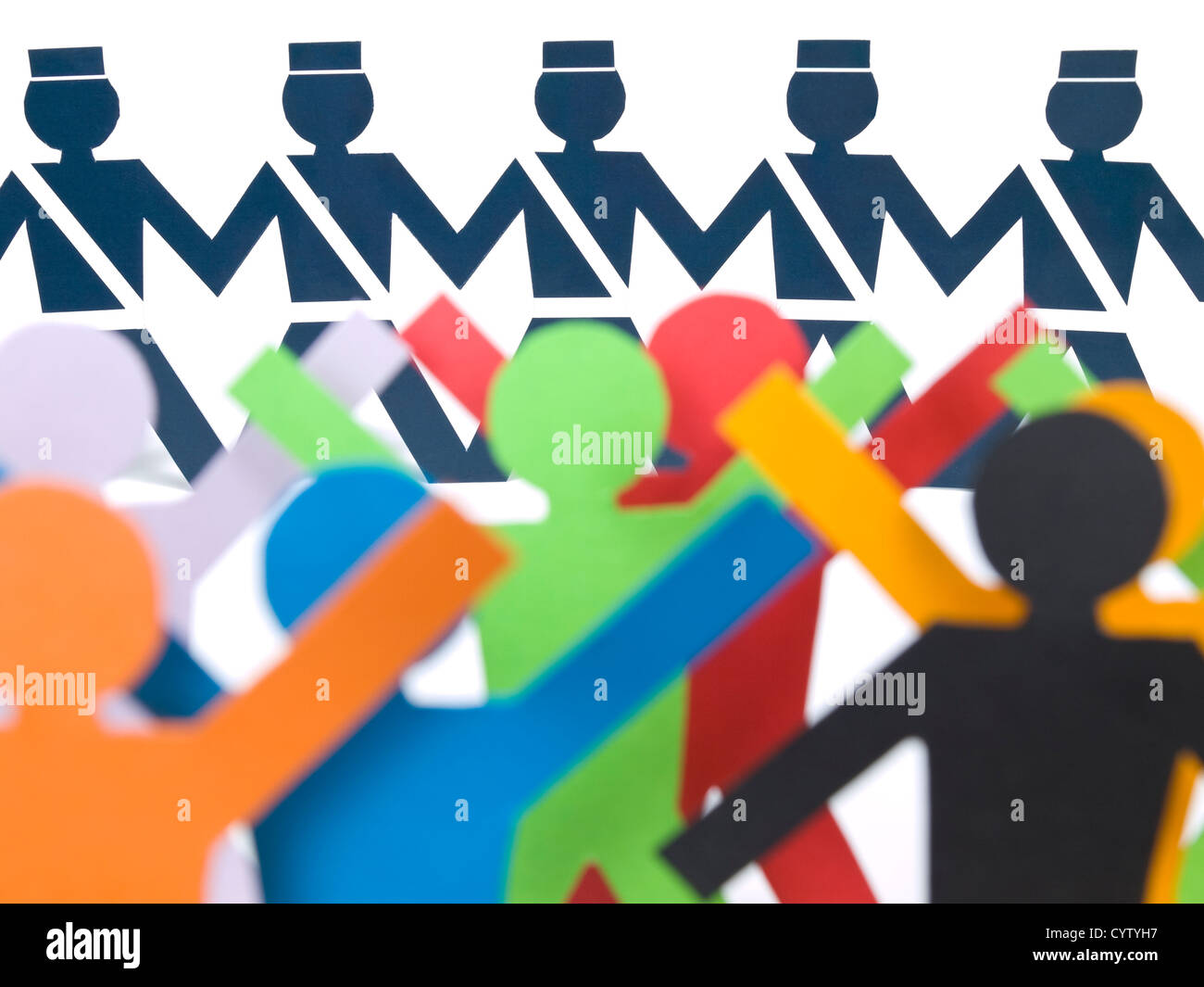 Several color paper figures standing before the paper police Stock ...