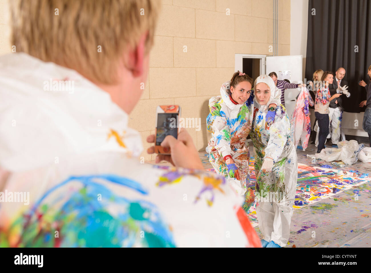 People having fun during art therapy session drawing paint Stock Photo ...