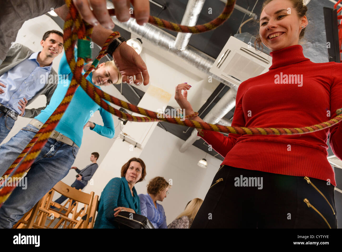 game rope fun activity office workers Stock Photo - Alamy