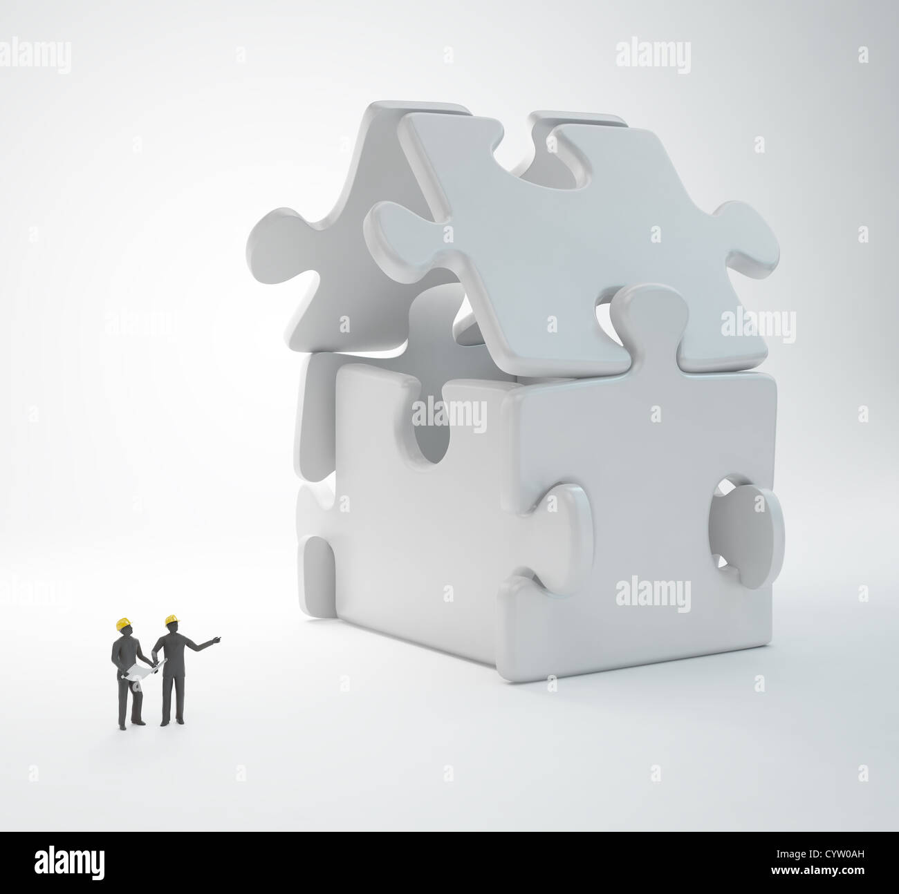 Two tiny people engineers building a puzzle house Stock Photo - Alamy