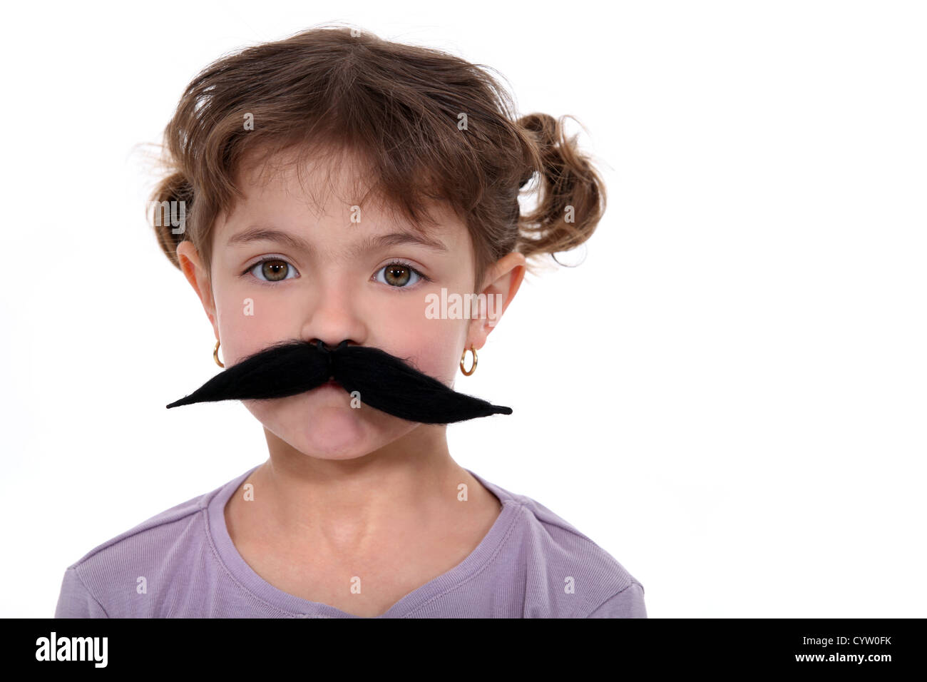 Little girl wearing a false mustache Stock Photo - Alamy
