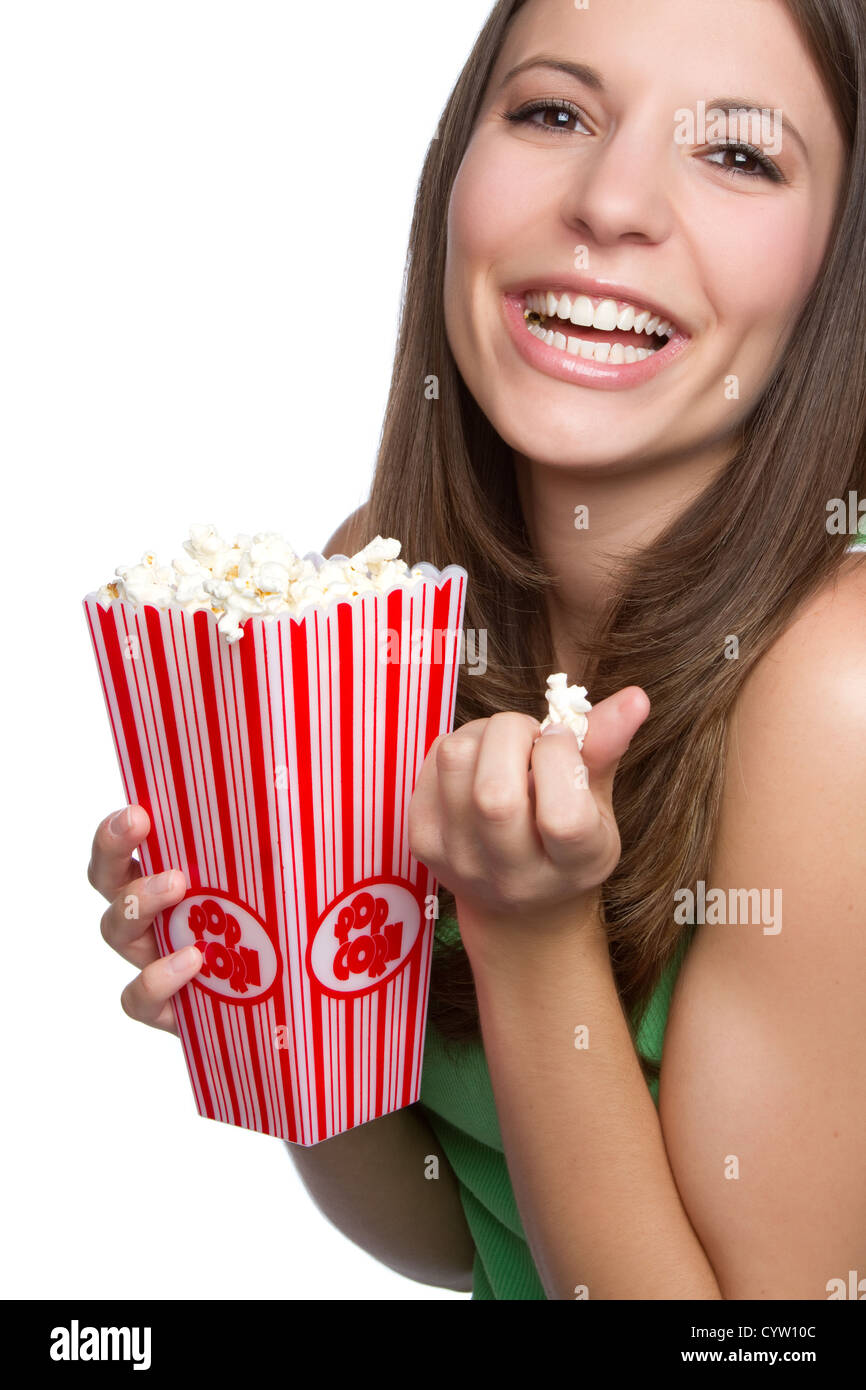 Pretty smiling girl eating popcorn Stock Photo - Alamy