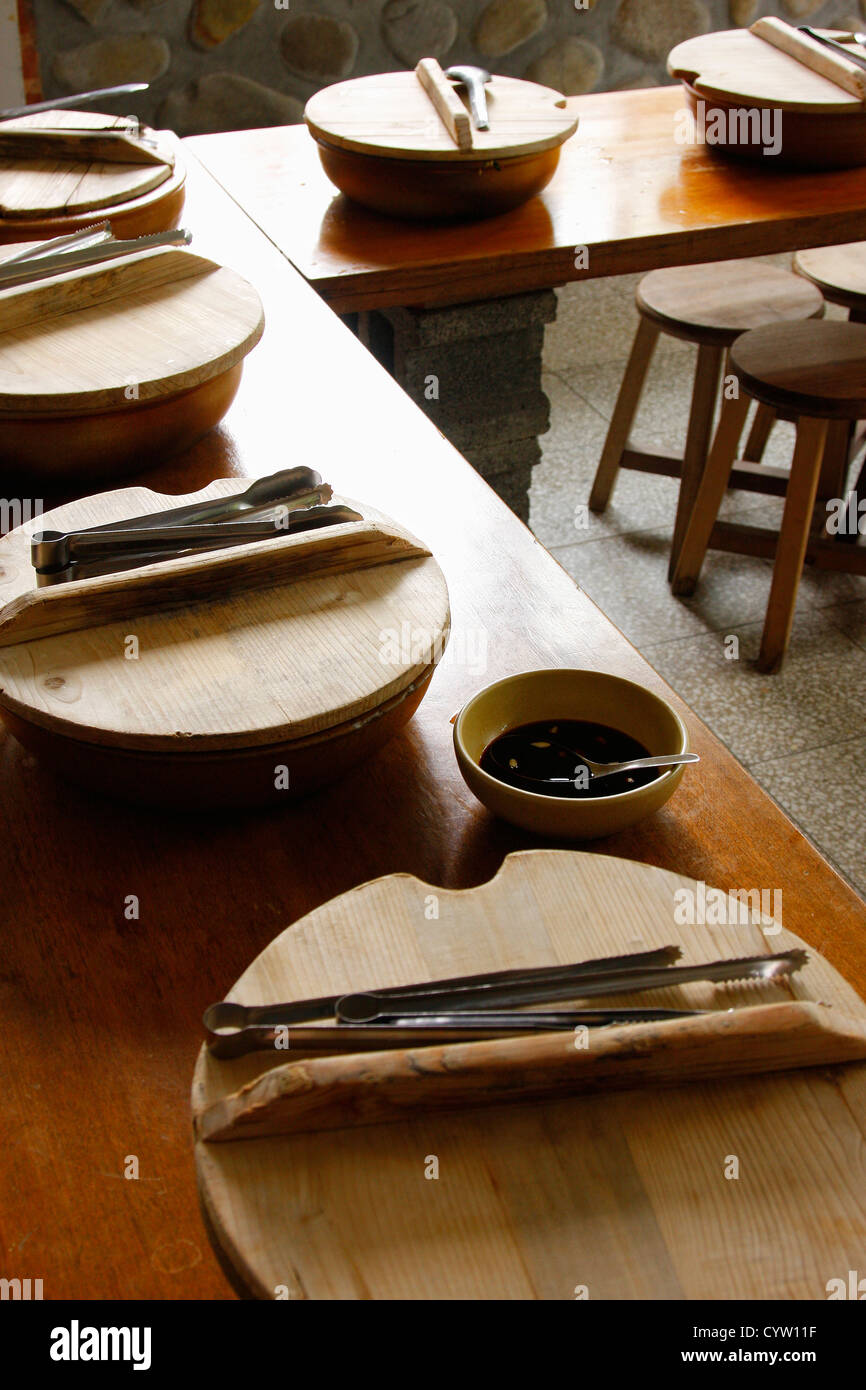 Ceramic pots with wooden covers Stock Photo - Alamy