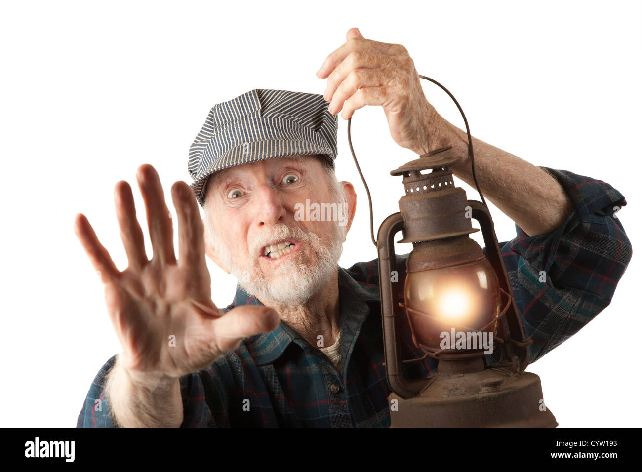 Apprehensive railroad man holding a glowing red lantern Stock Photo - Alamy
