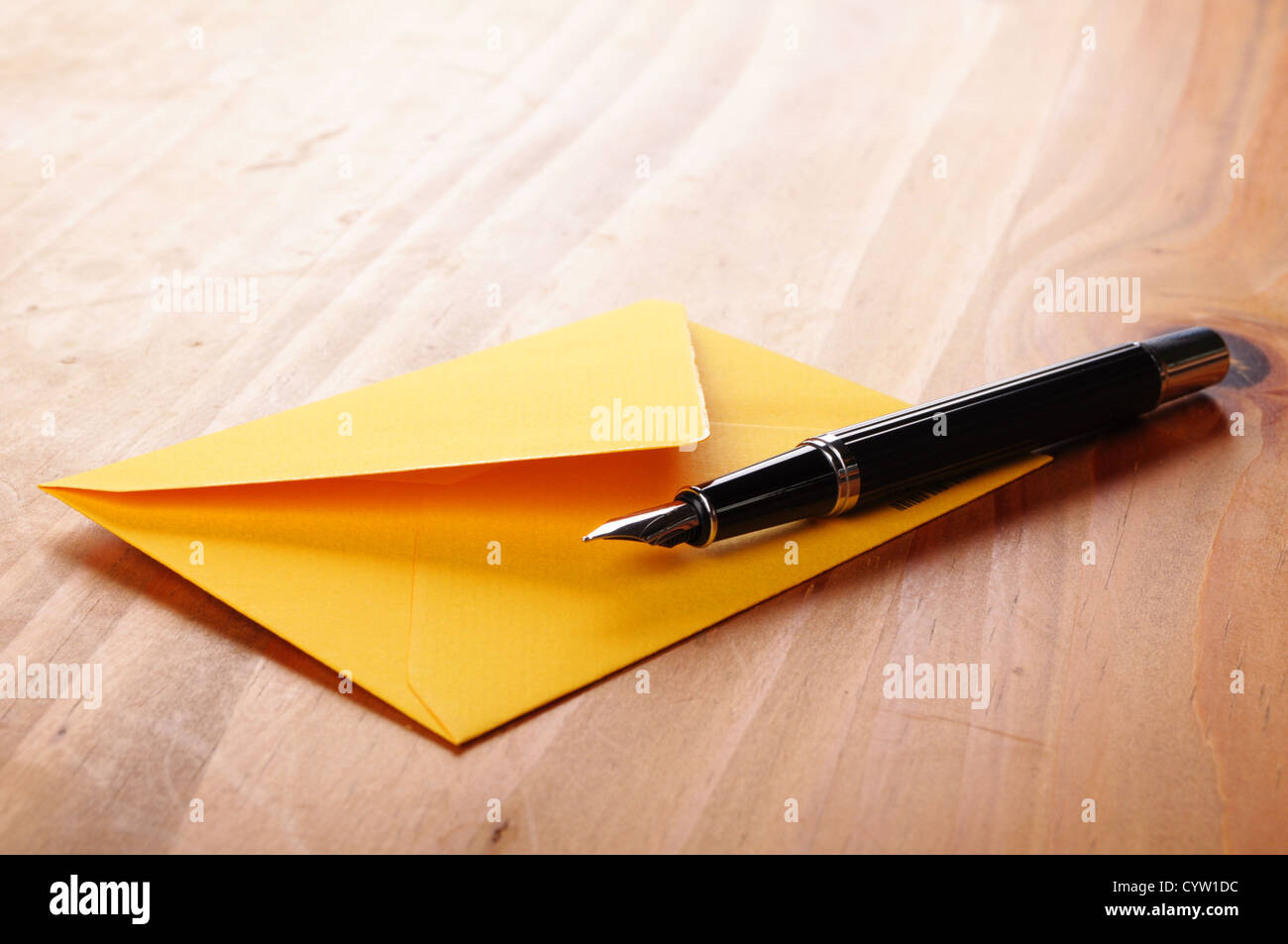 mail or email concept with envelope and pen Stock Photo - Alamy