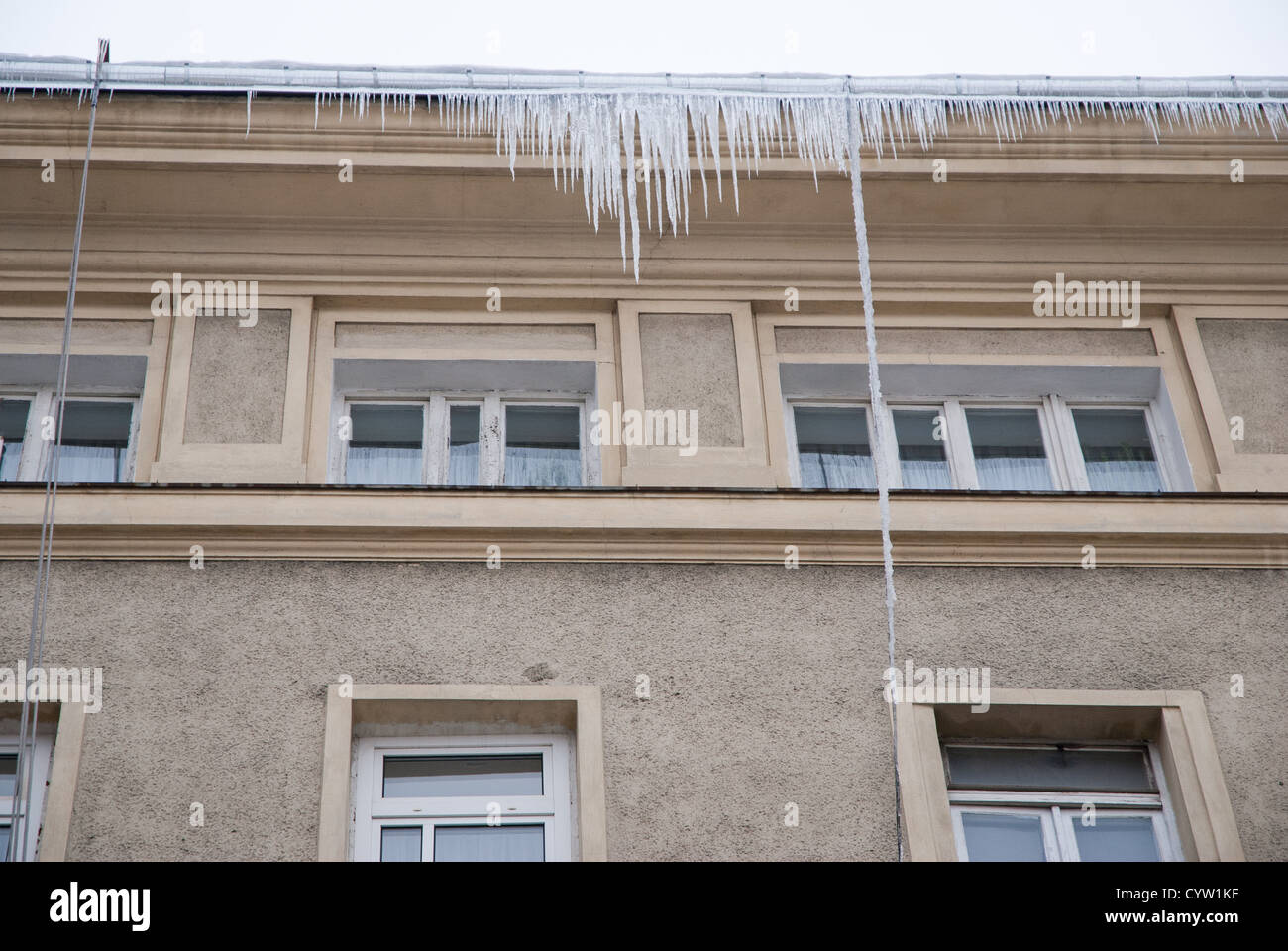 dangerous icicles on the building Stock Photo - Alamy