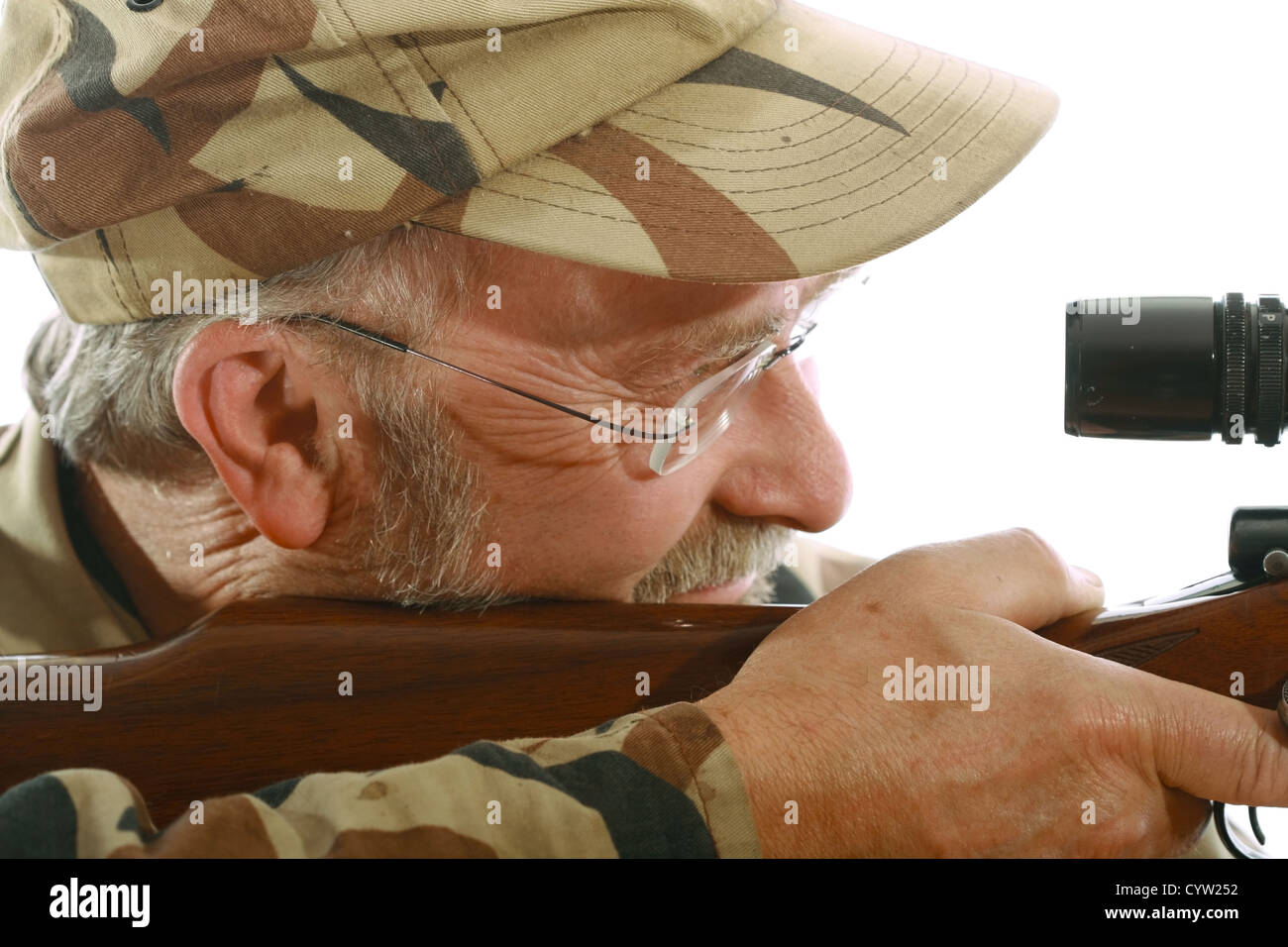 Hunter looking through the scope of his riffle Stock Photo - Alamy