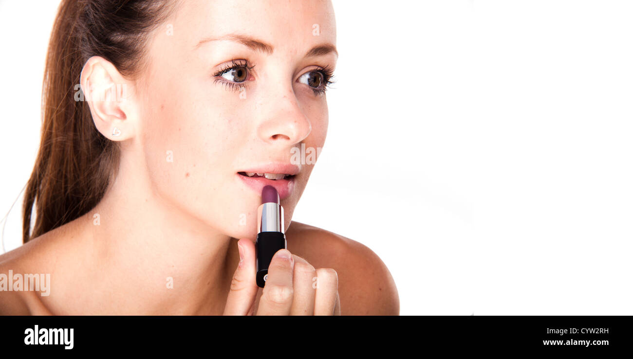 female applying a lipstick Stock Photo - Alamy
