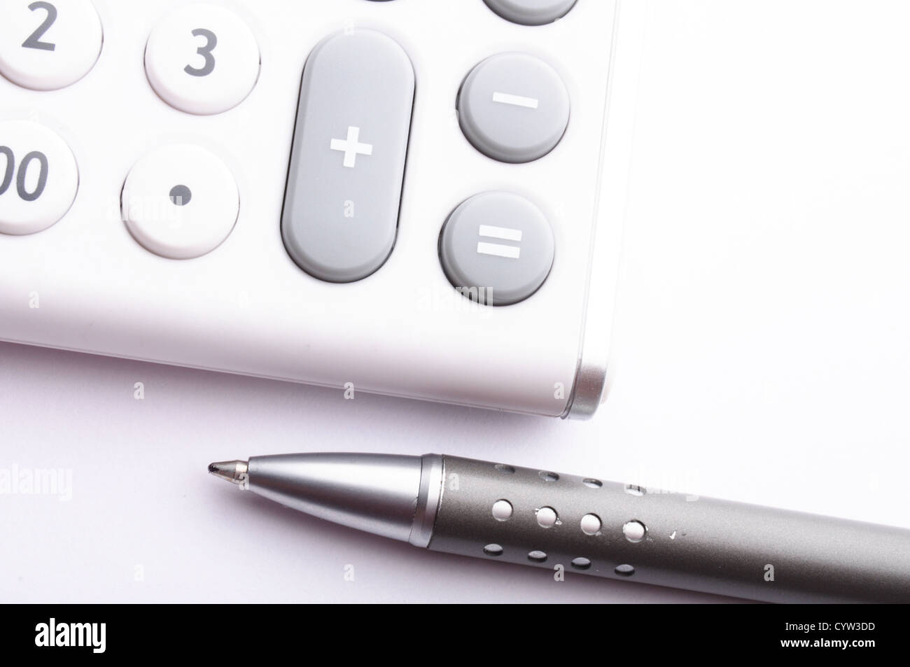 adding up figures concept with modern white calculator in office Stock ...