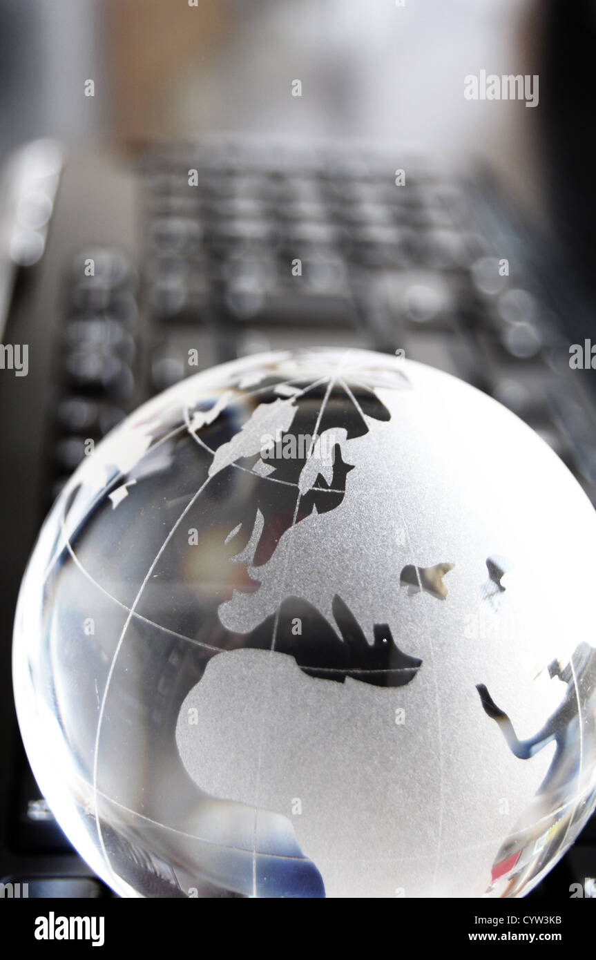 globe and keyboard showing global communication or internet concept ...