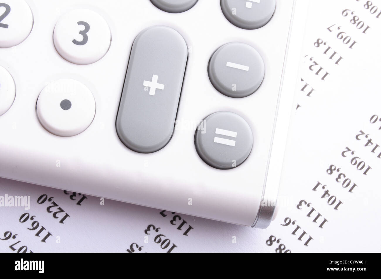 adding up figures concept with modern white calculator in office Stock ...