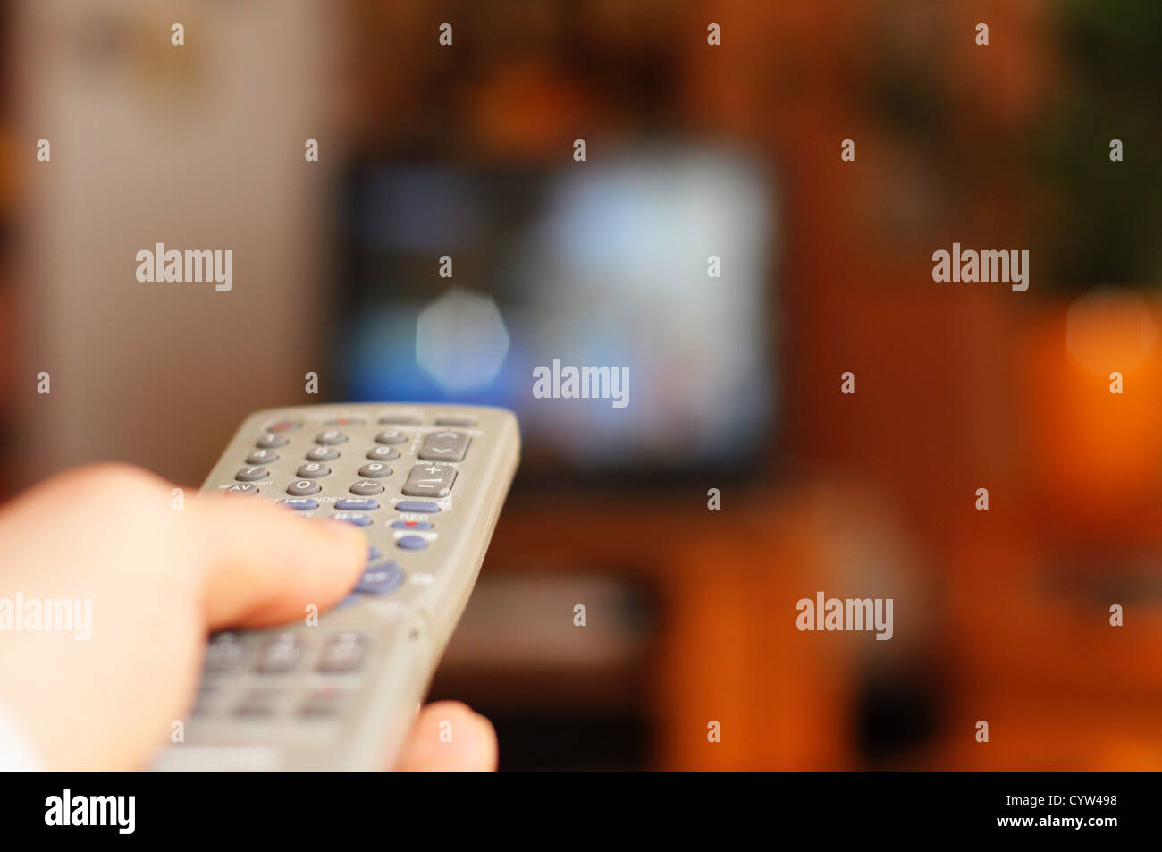 watch tv concept with hand remote control and copyspace for text ...