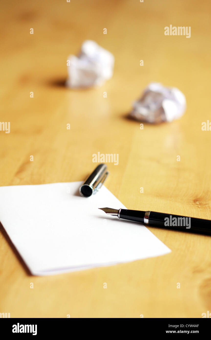 pen and paper in a wooden desktop showing creativity concept Stock ...