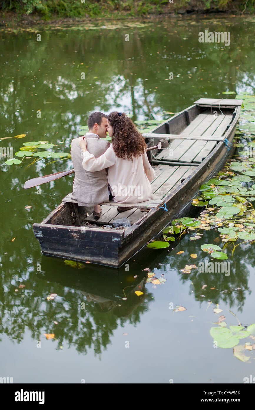 Romantic young couple in the boat Stock Photo - Alamy