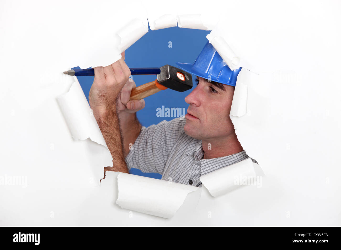 Manual worker using hammer and chisel Stock Photo - Alamy