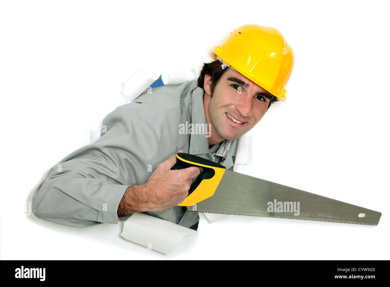 Tradesman holding a saw Stock Photo - Alamy