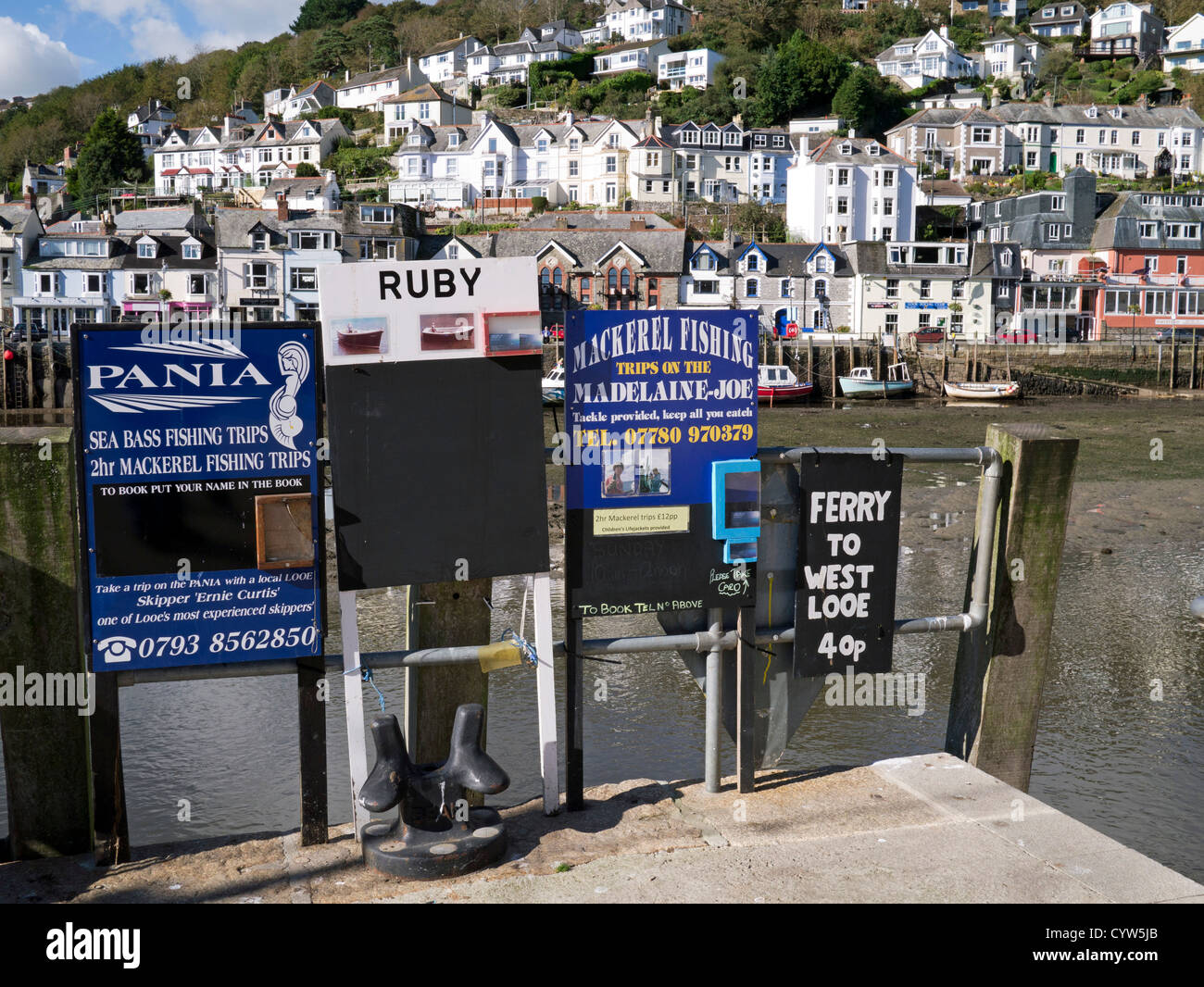 Harbour side signs at Looe in Cornwall Uk Stock Photo - Alamy
