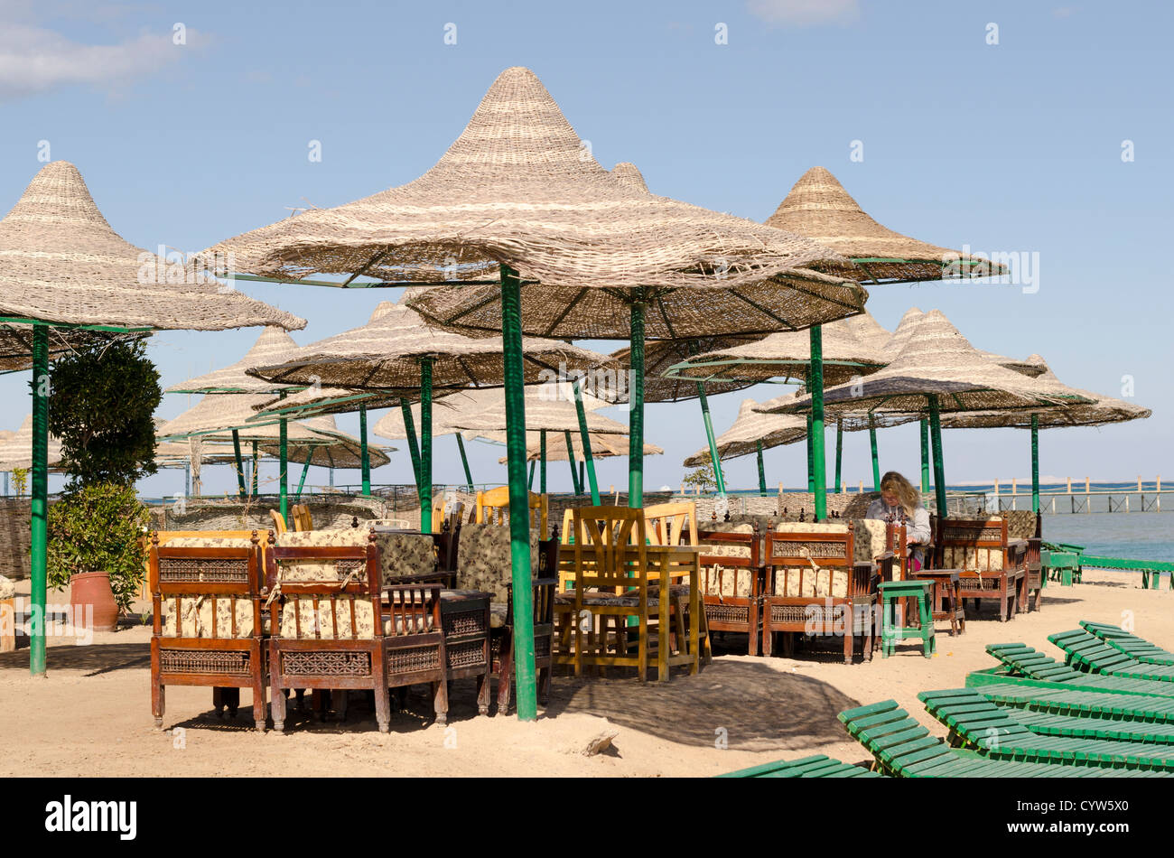woman cafe reading umbrella beach sea Stock Photo - Alamy