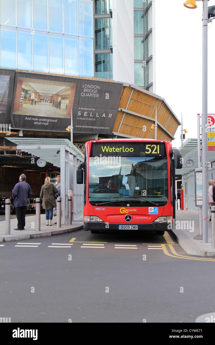London red bus outside London Bridge train station Stock Photo - Alamy