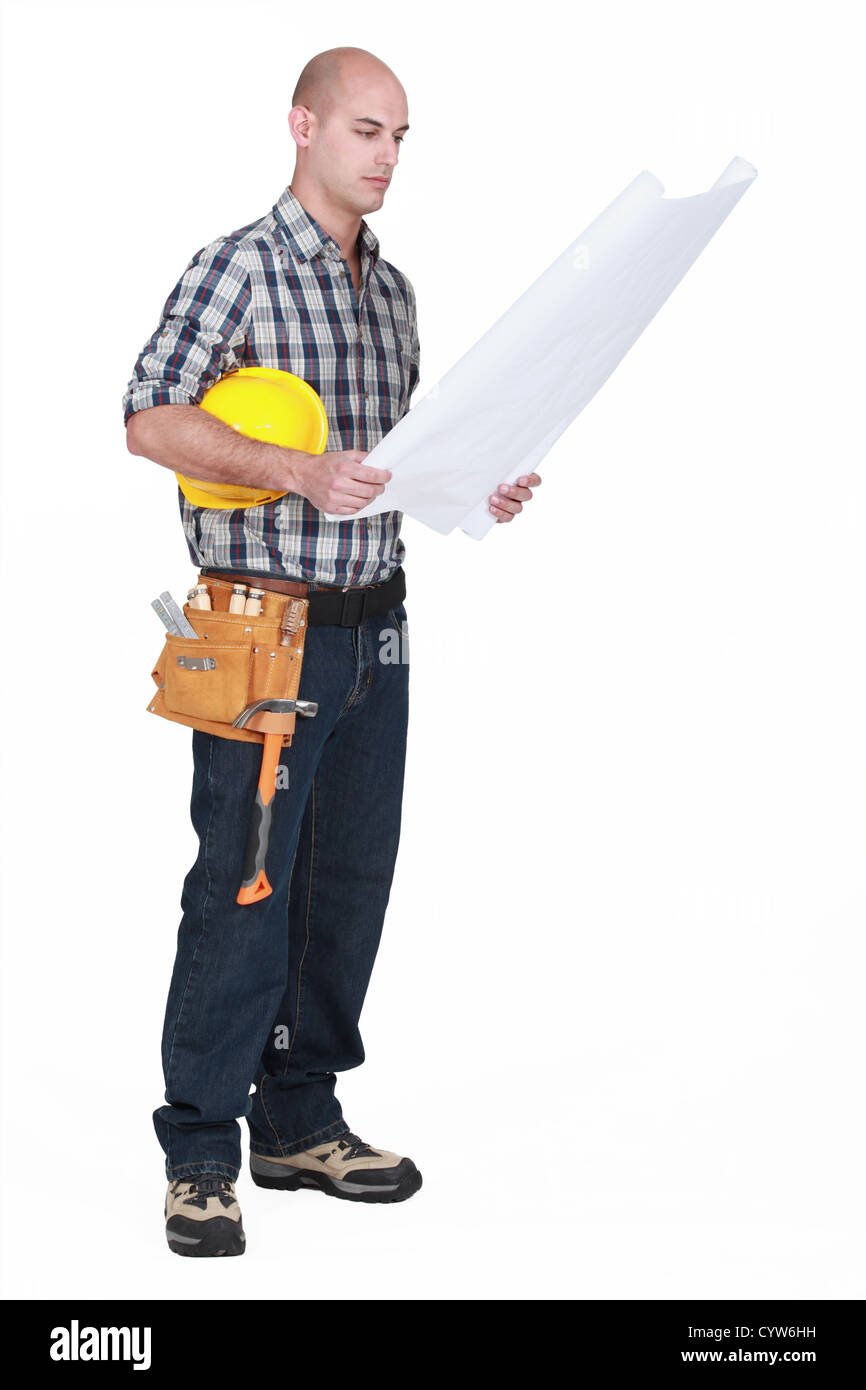 A foreman checking the plans Stock Photo - Alamy