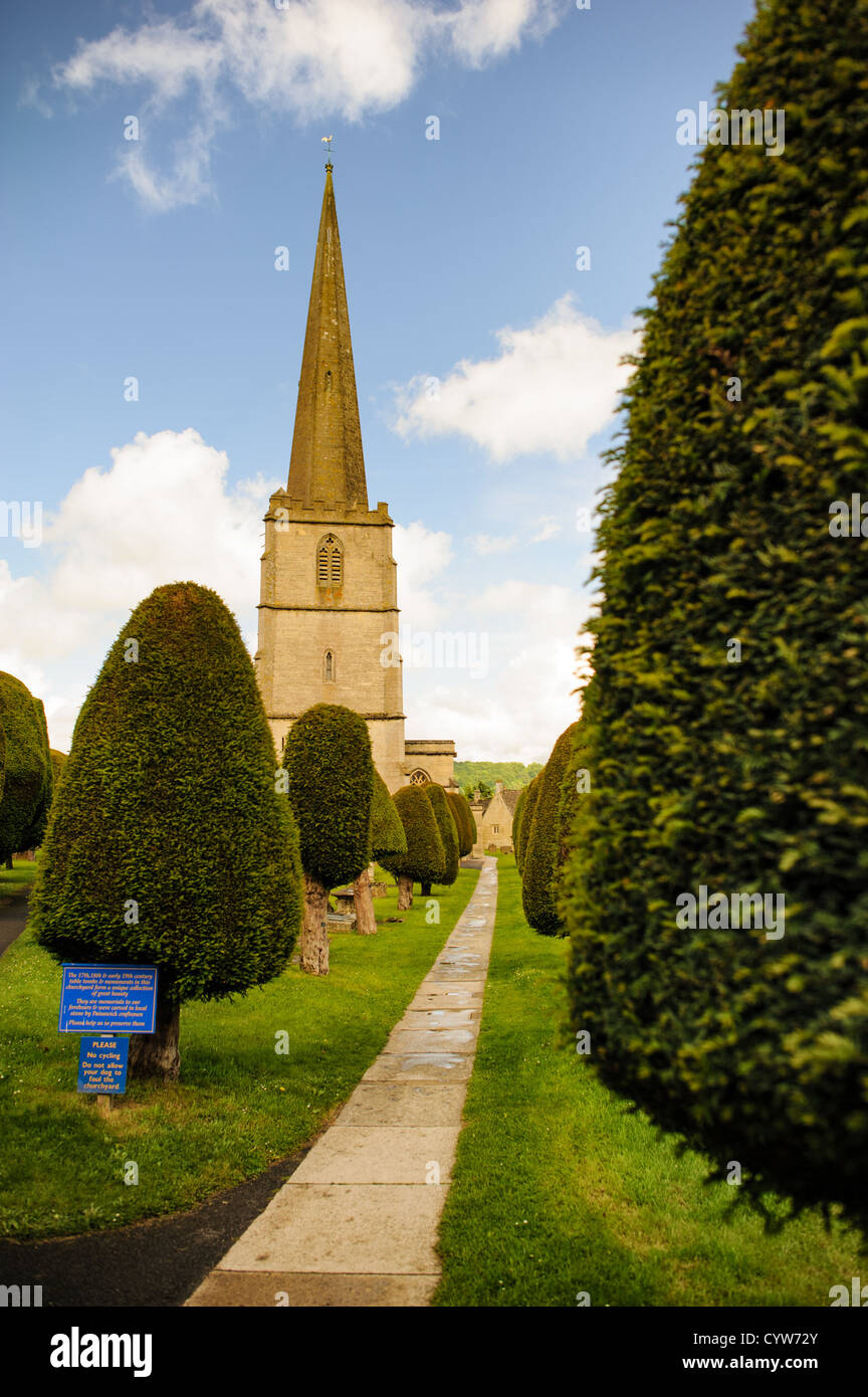 PAINSWICK, United Kingdom — Walkway through the Yew trees and steeple ...