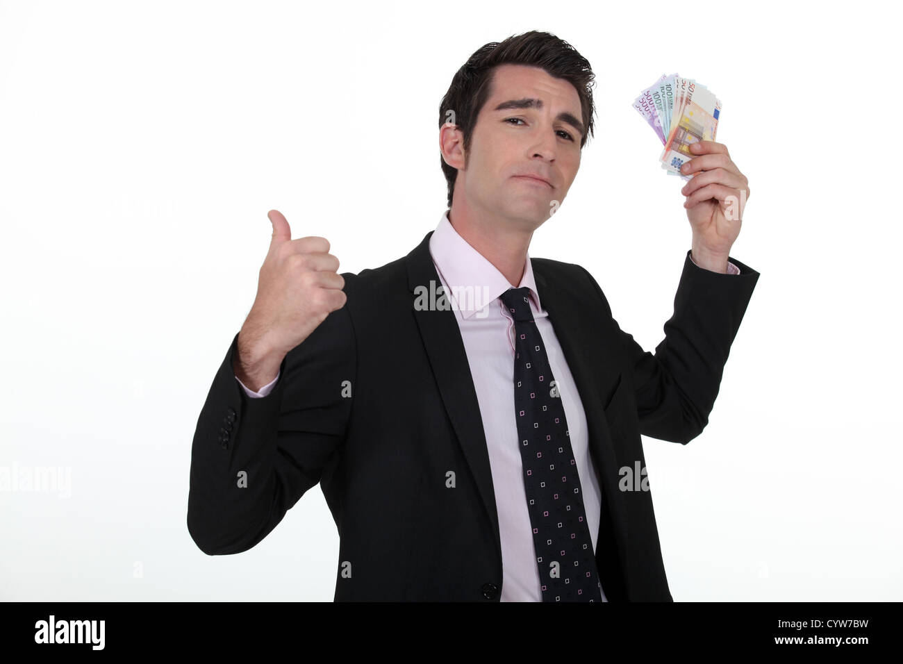 A businessman with a lot of cash Stock Photo - Alamy