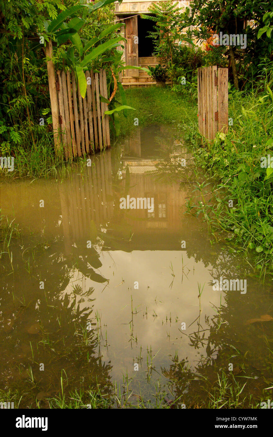 Abandoned house flooded by monsoon rain at Mandalay Stock Photo - Alamy