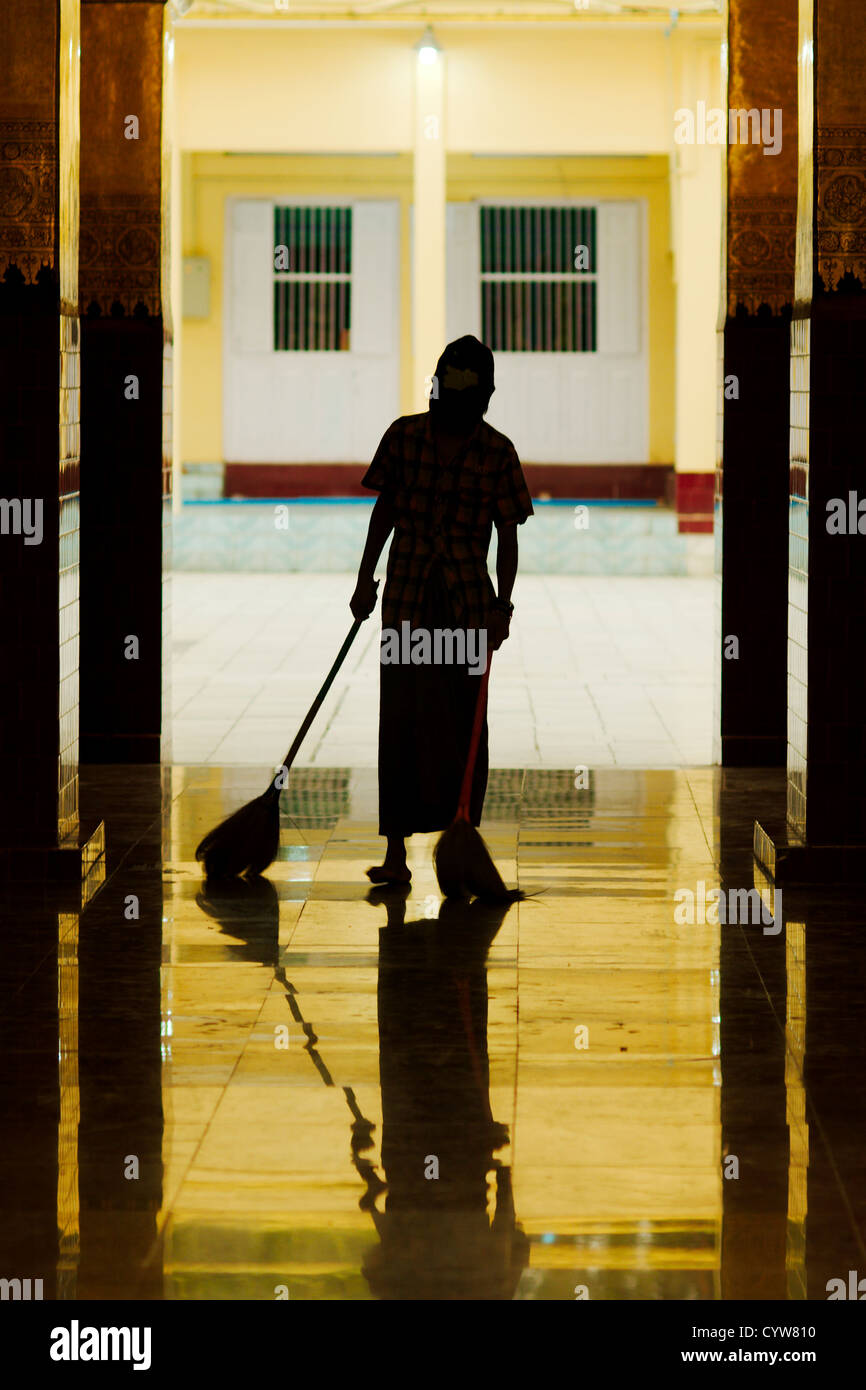 Women brooming Mahamuni Stock Photo - Alamy