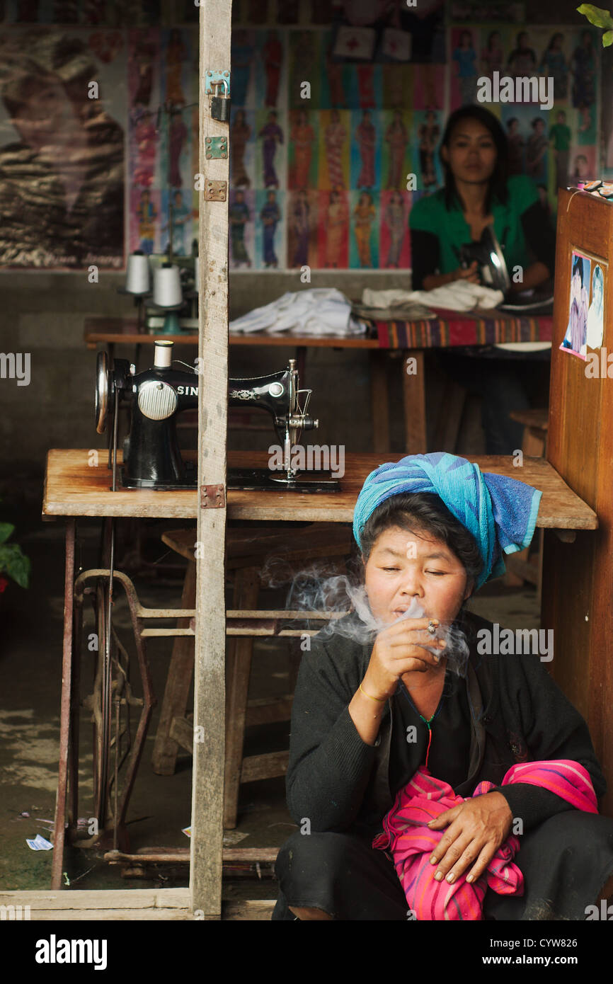 Woman smoking outside shop hi-res stock photography and images - Alamy