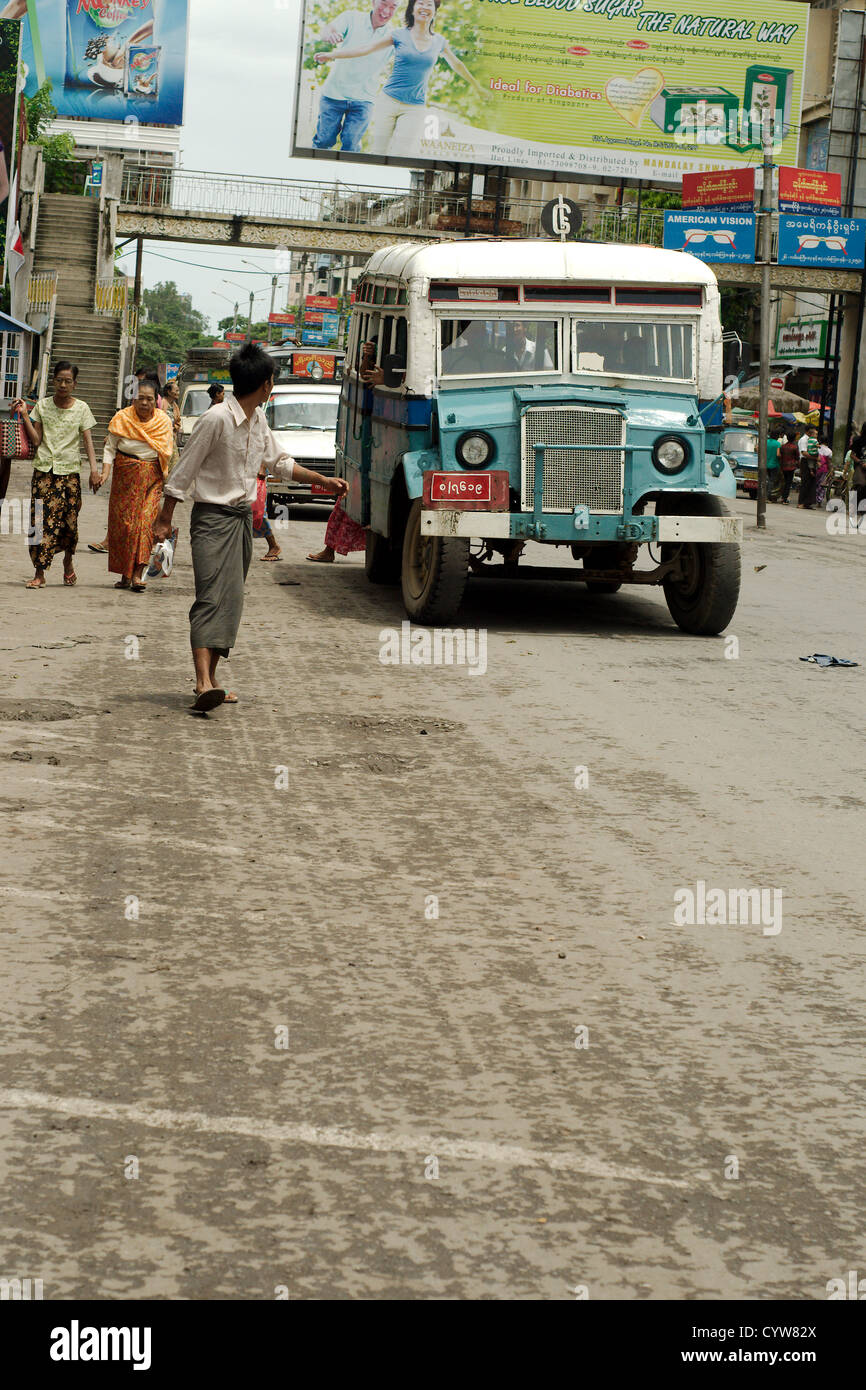Bus at one of the avenues of Mandalay Stock Photo - Alamy