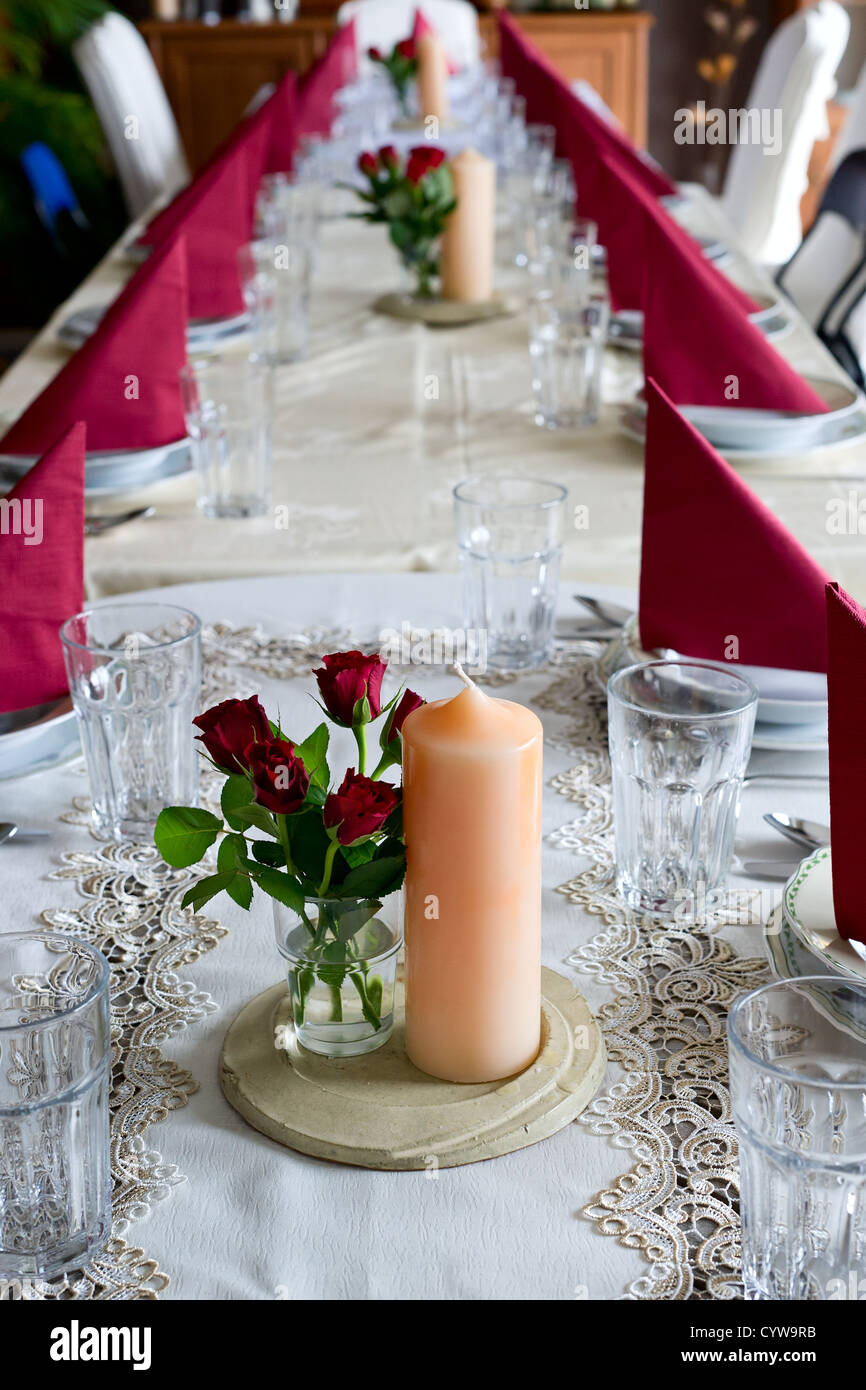 Banquet table setting themed with roses Stock Photo - Alamy