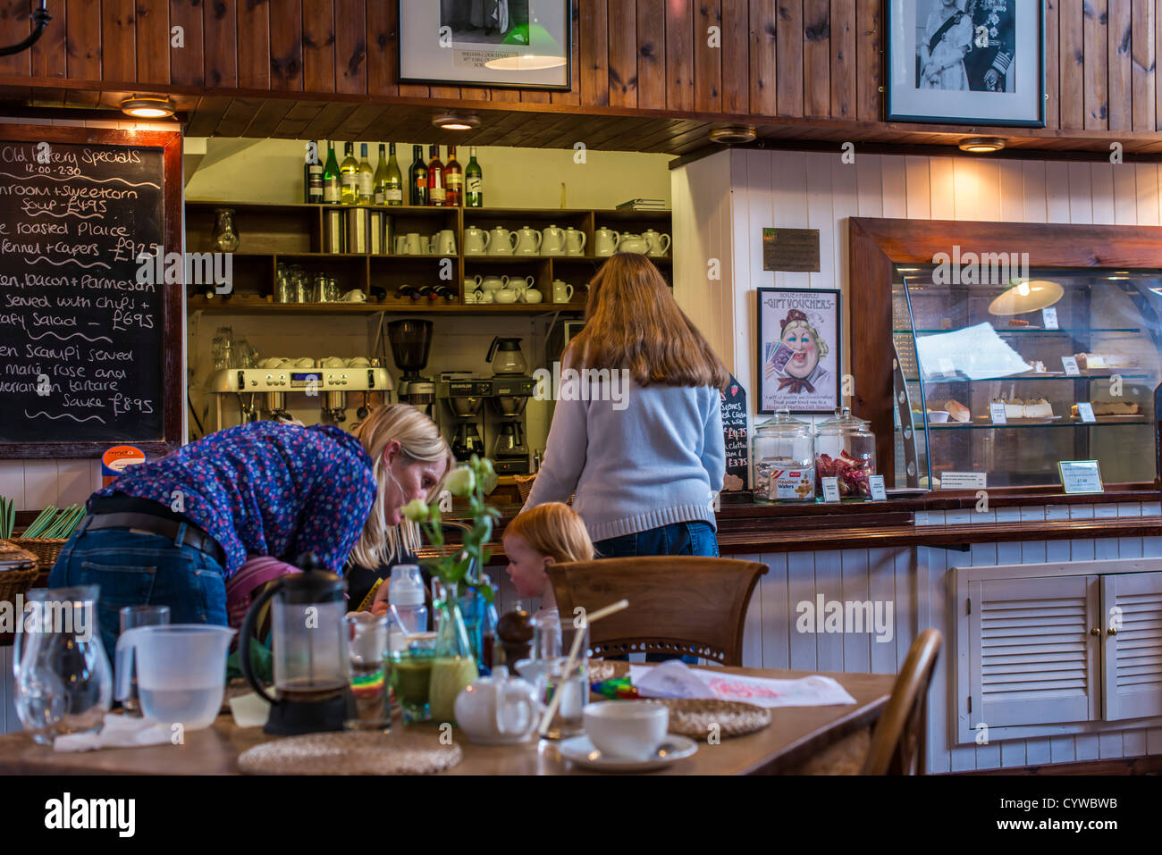 Bovey Tracey, Devon, England. November 8th 2012. A cafe scene with a ...