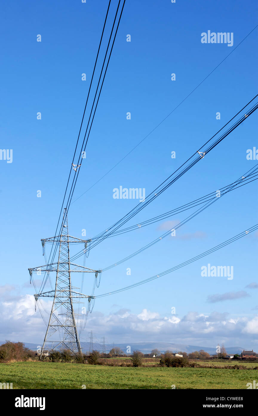 Electricity pylon and cables stretching across countryside Stock Photo ...