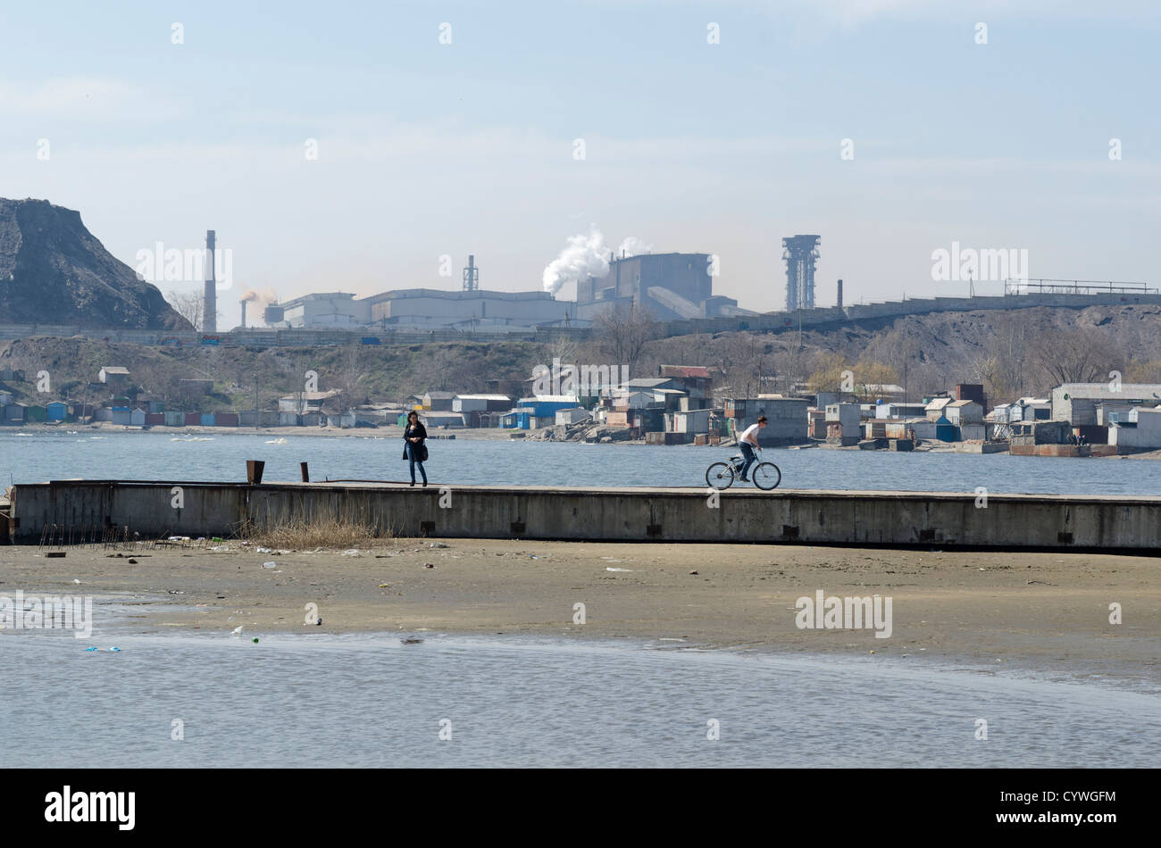 [Azov sea] Mariupol riding bicycle industrial man Stock Photo - Alamy