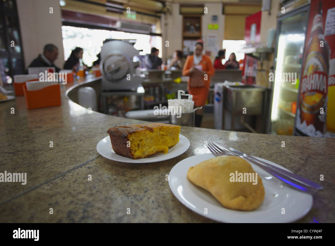 Sopa paraguaya (cornbread with cheese and onion) and empanada in Lido ...