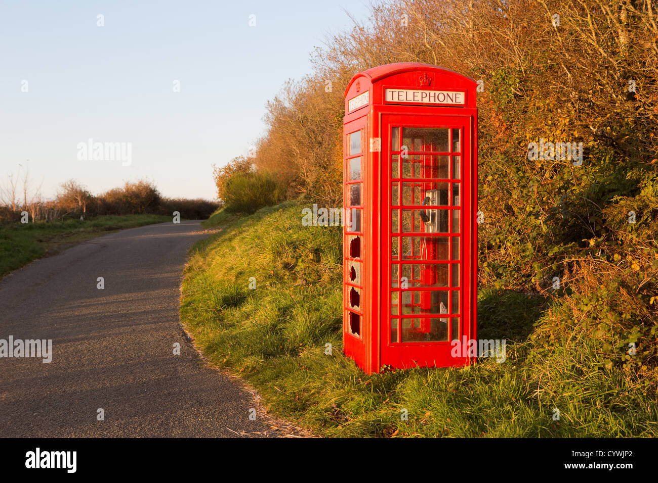 A red English phone box in the countryside Stock Photo - Alamy