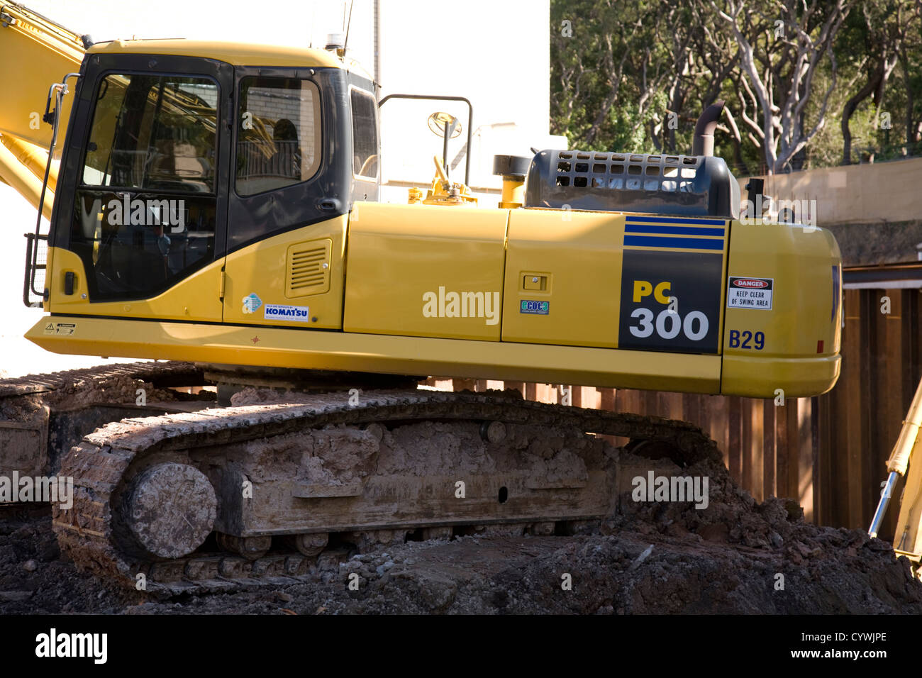 yellow excavator machine Stock Photo - Alamy
