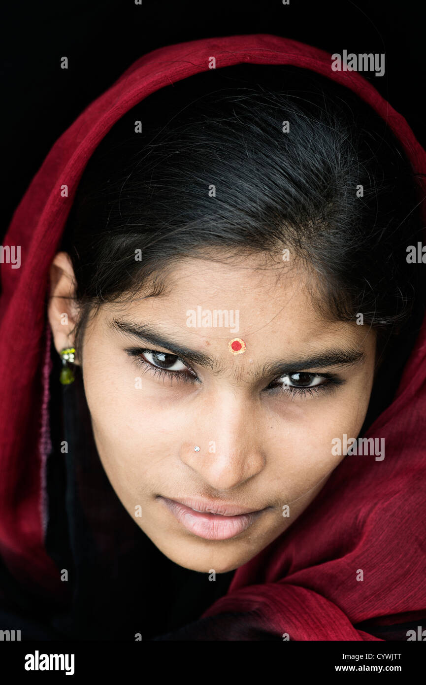 Indian girl wearing a red veil against a black background. Andhra ...