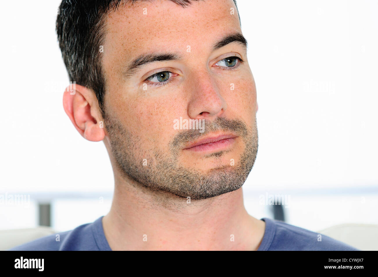 natural and relaxed looking young man Stock Photo - Alamy