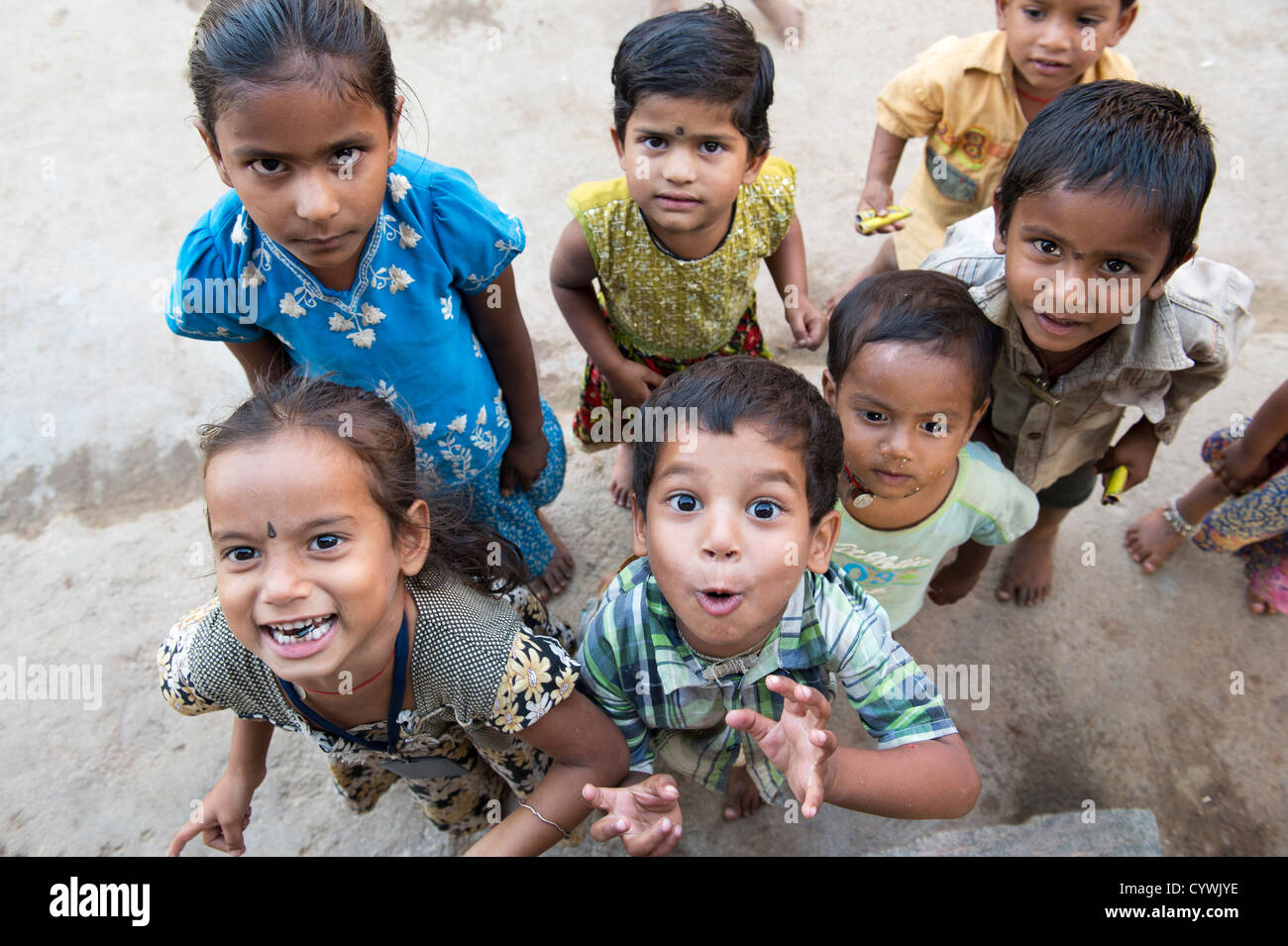 Happy young rural Indian village children laughing and smiling looking up to camera. India Stock ...