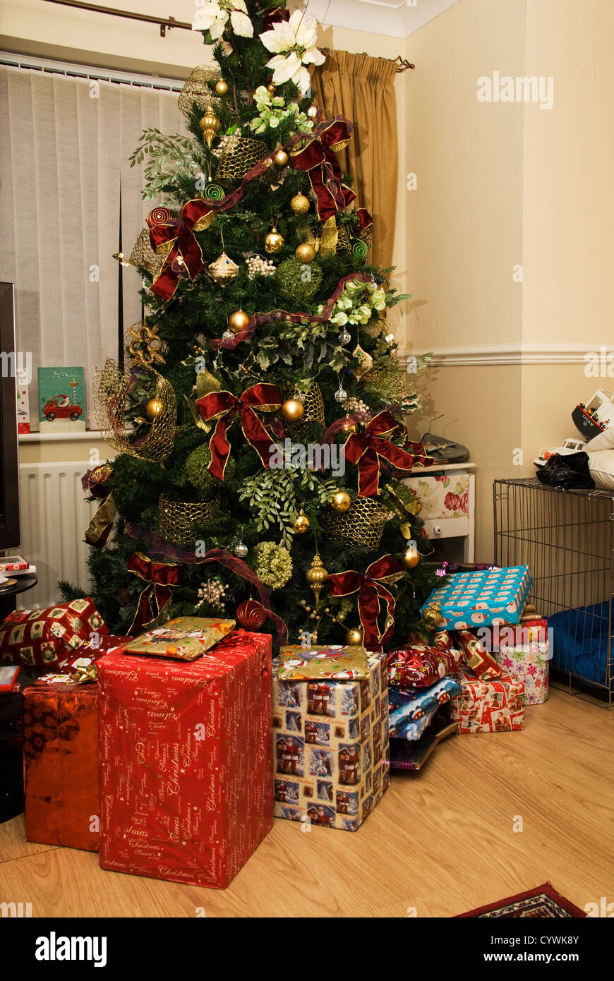 Christmas presents underneath a Christmas tree Stock Photo - Alamy