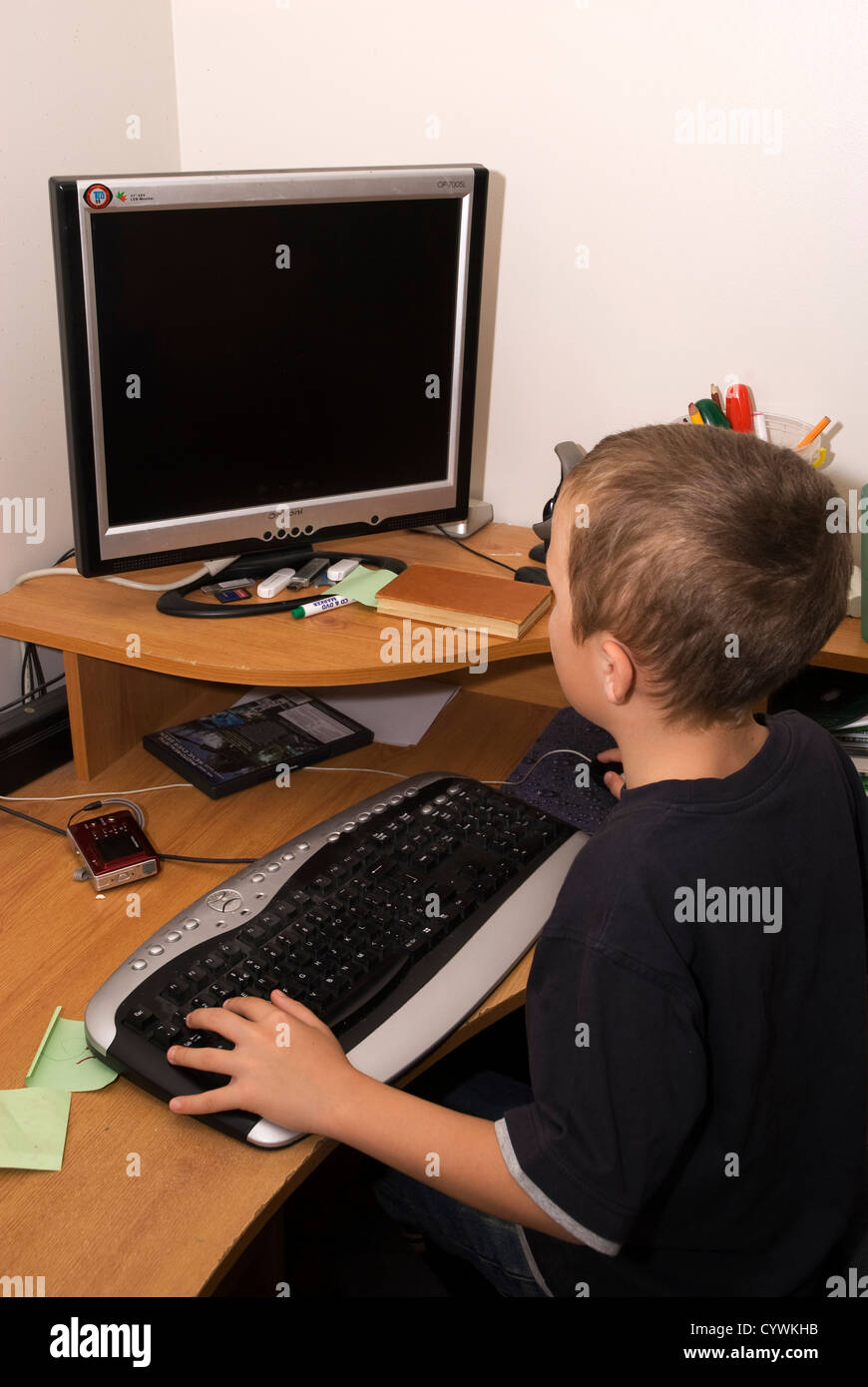 A child playing on a home computer Stock Photo - Alamy