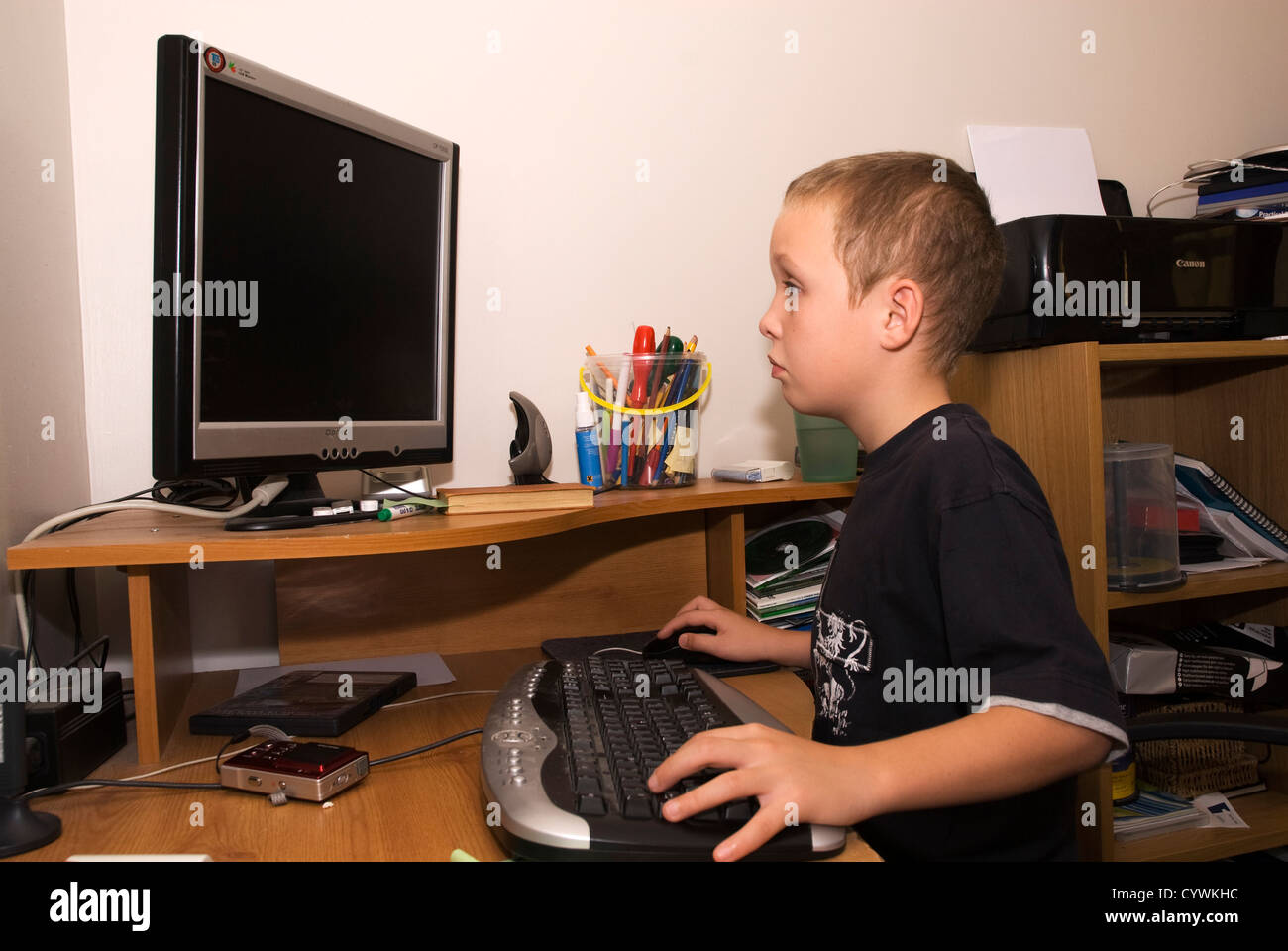 A child playing on a home computer Stock Photo - Alamy