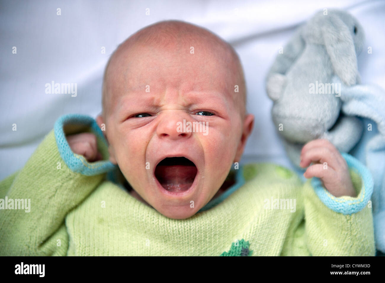 A crying new born baby Stock Photo - Alamy
