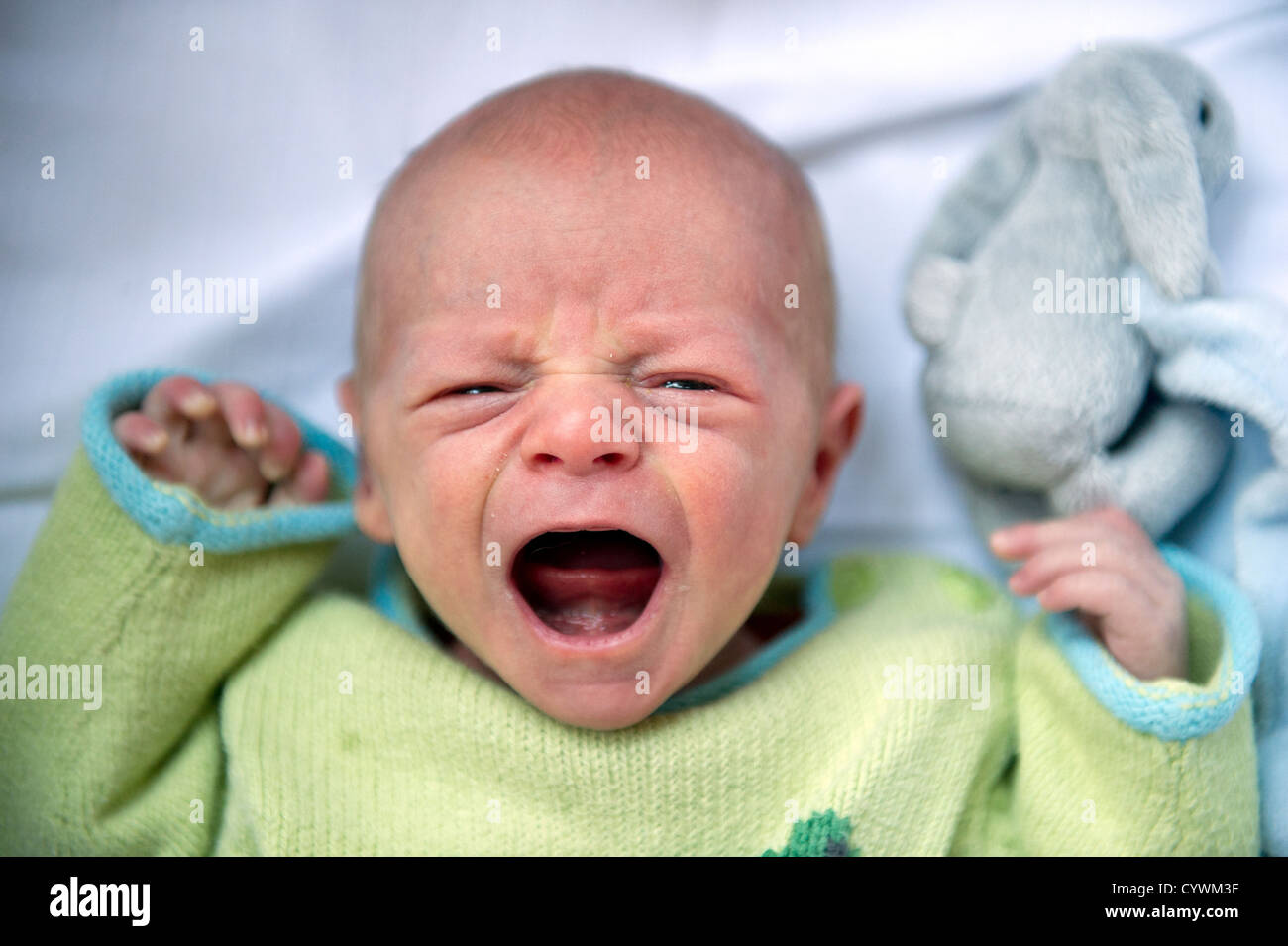 A crying new born baby Stock Photo - Alamy
